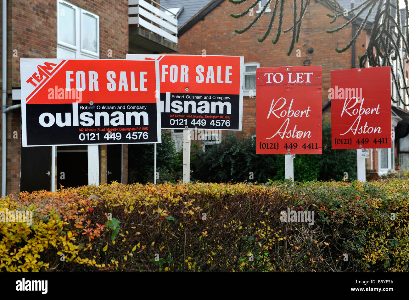 A group of house for sale signs in Birmingham West Midlands England UK ...