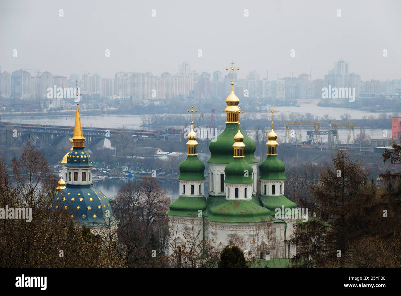Domes of Vydubetsky monastery against river Dnieper with bridge and ...