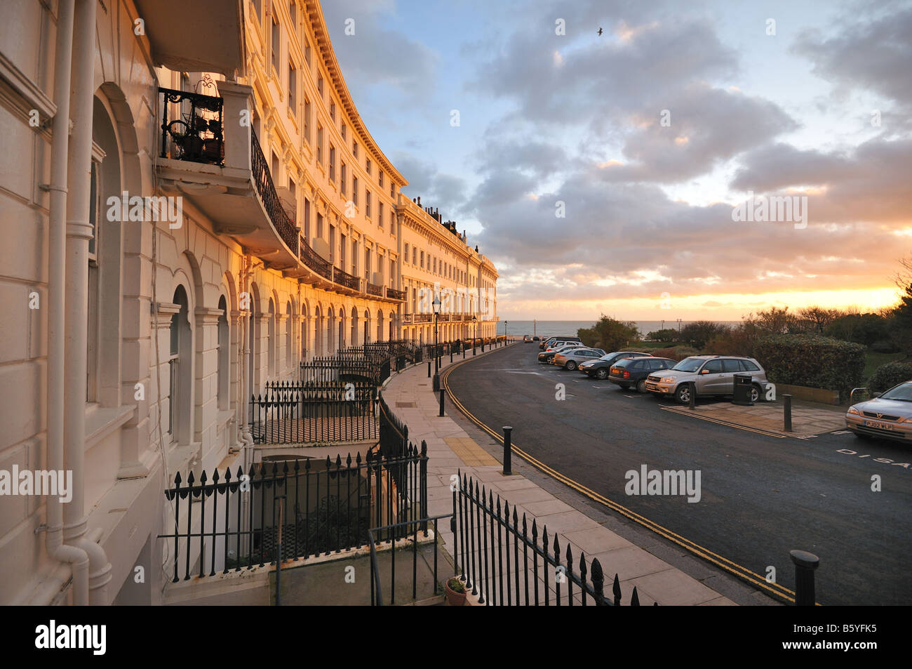 Regency style housing on the Brighton seafront at dusk, Brighton, East ...