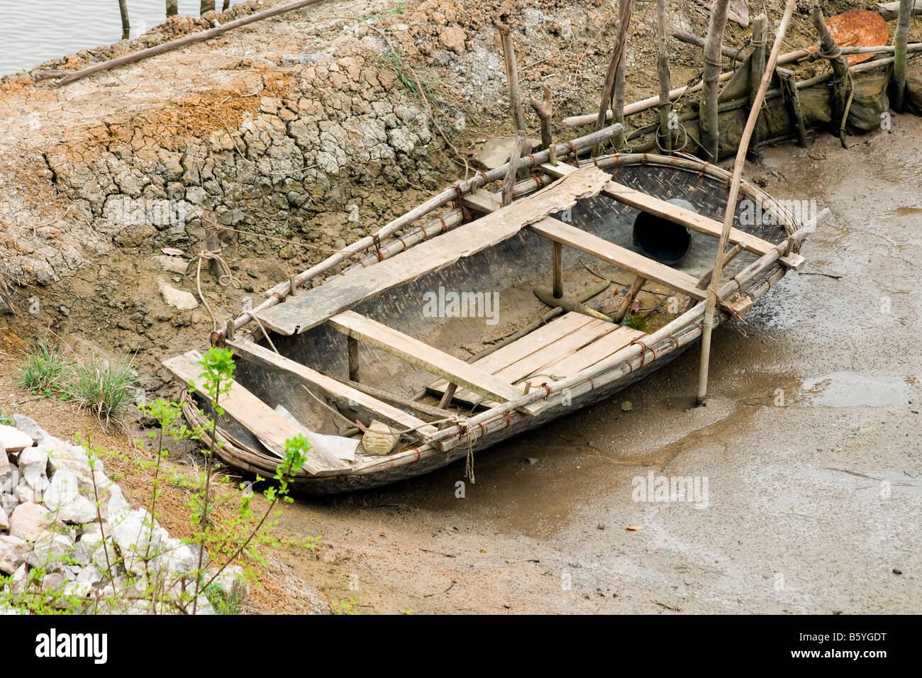 Vietnam boat wooden broken seaside mud,plant Stock Photo - Alamy