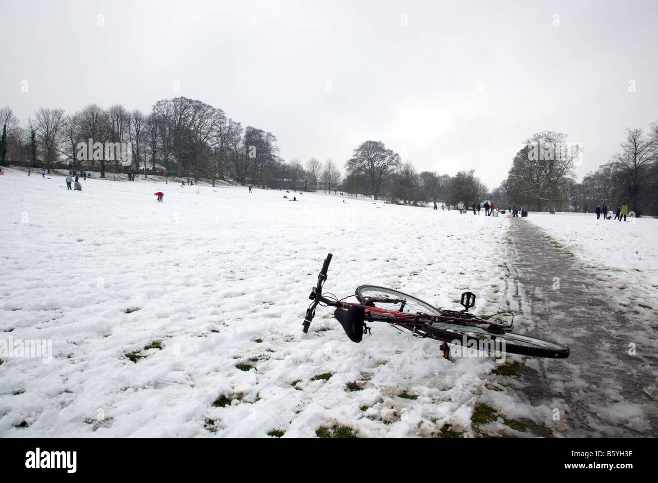 Push bike laying down abandoned in the snow in Westgate fields, Louth ...