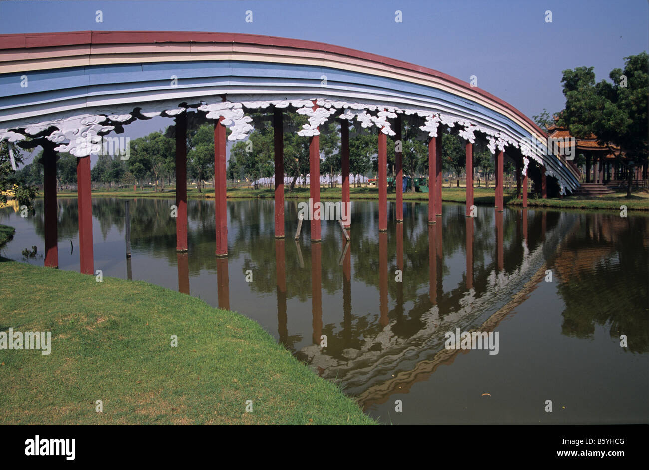 The multi-coloured Rainbow Bridge crosses a lake at the Ancient City ...