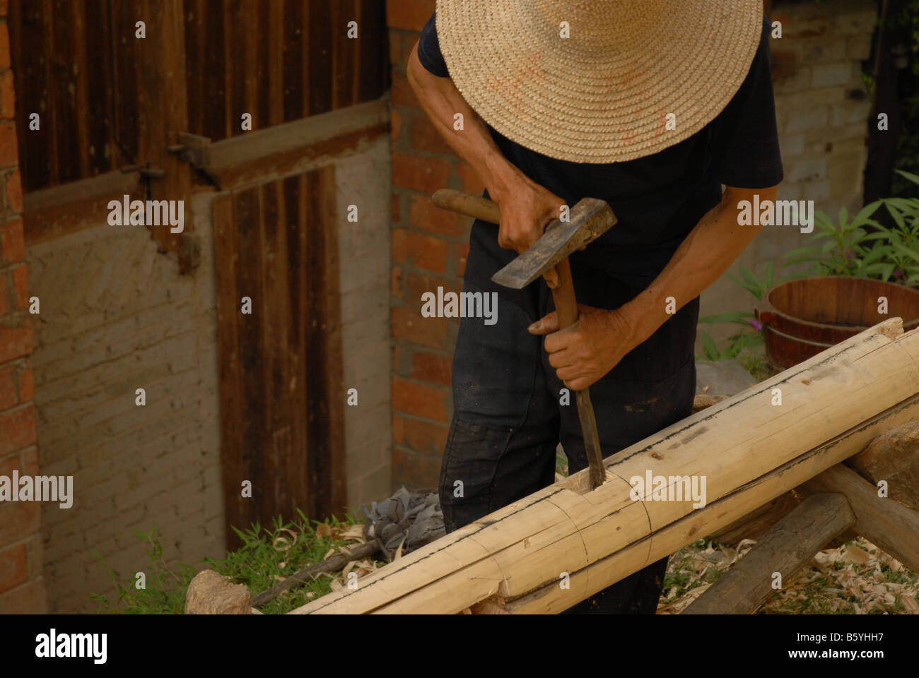 A craftsman at work in the traditional way in rural Guizhou Province ...