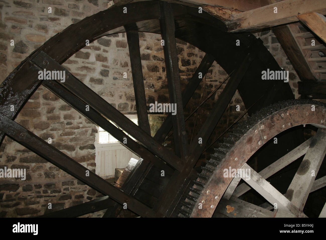Wheels from the inside of a windmill Stock Photo - Alamy