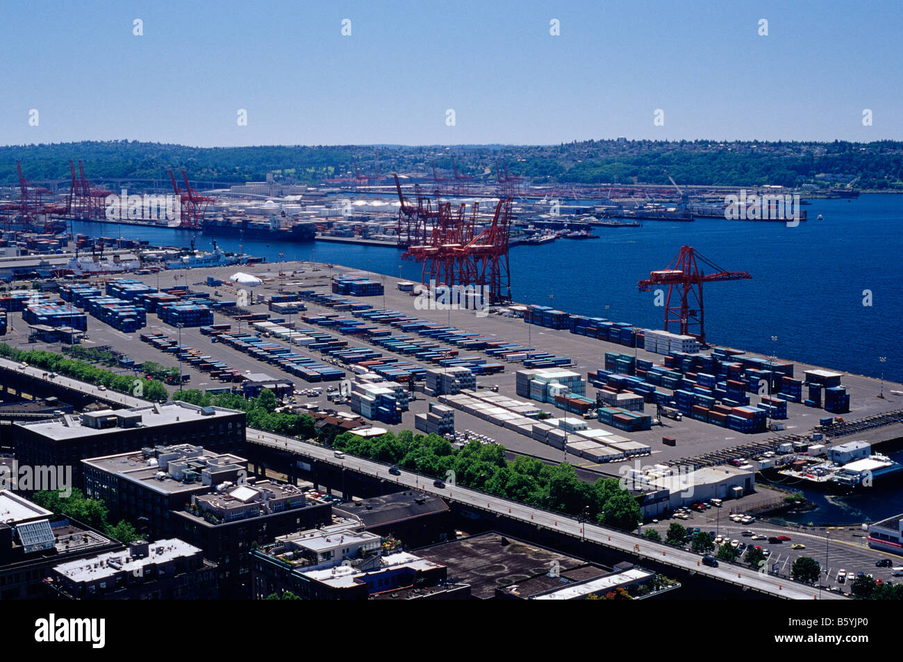 Port of Seattle with large cranes in a row and loading docks Seattle ...