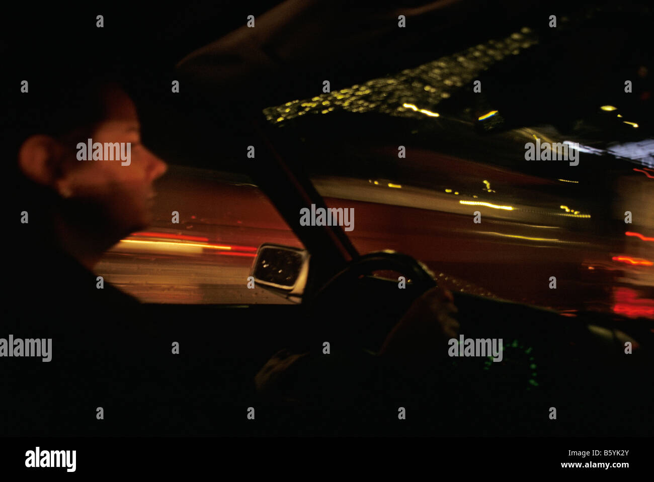 Rush hour traffic with woman looking out windshield at cars break ...