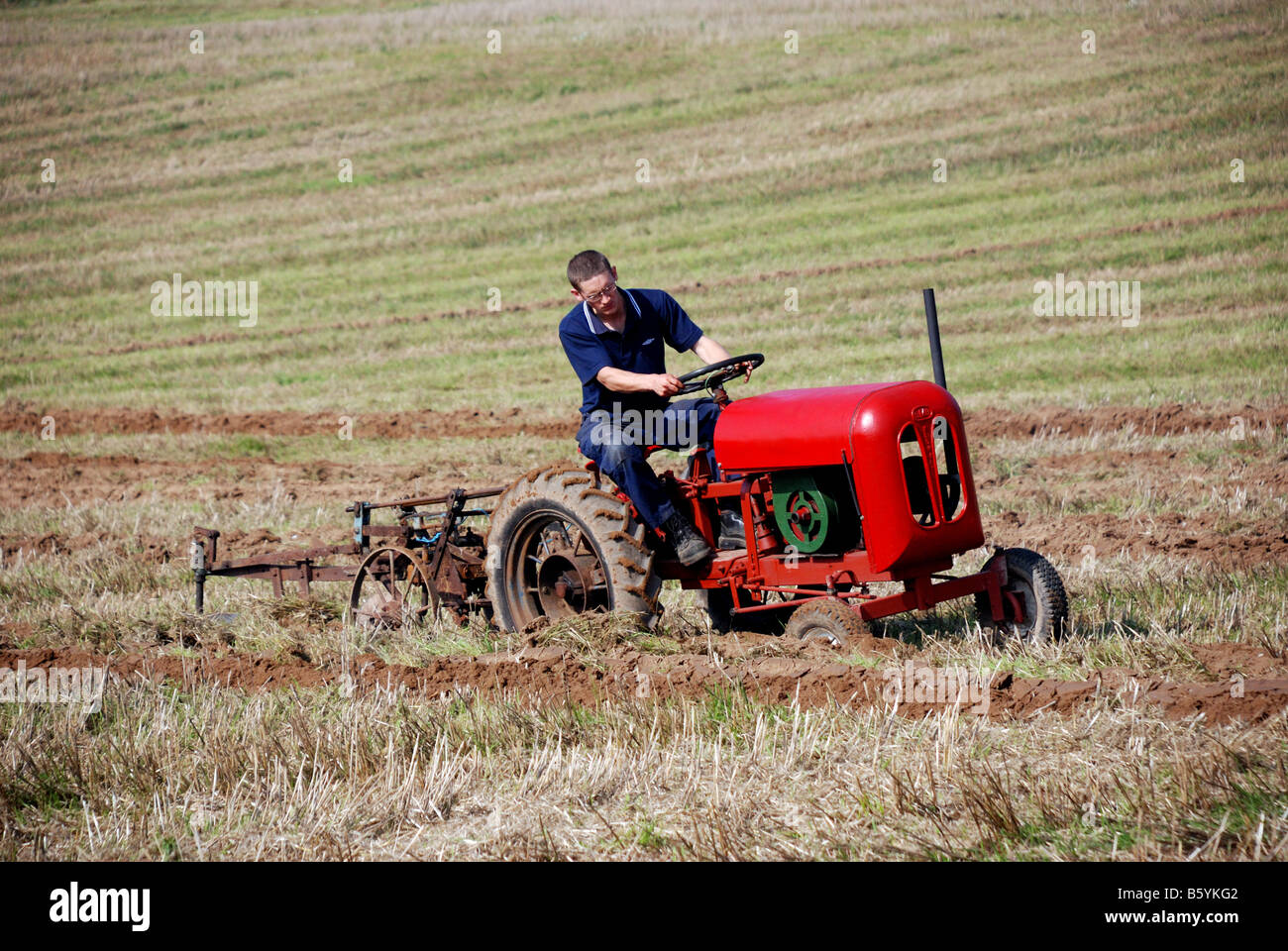 BMB Plowmate vintage sit on tractor and plough at the Surrey County ...