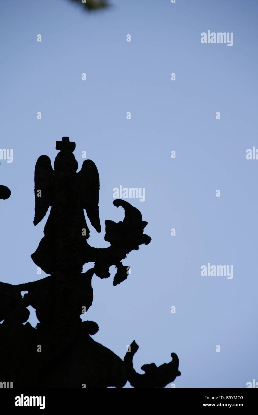 angel with cross on top of wrought iron gate in rome italy Stock Photo ...