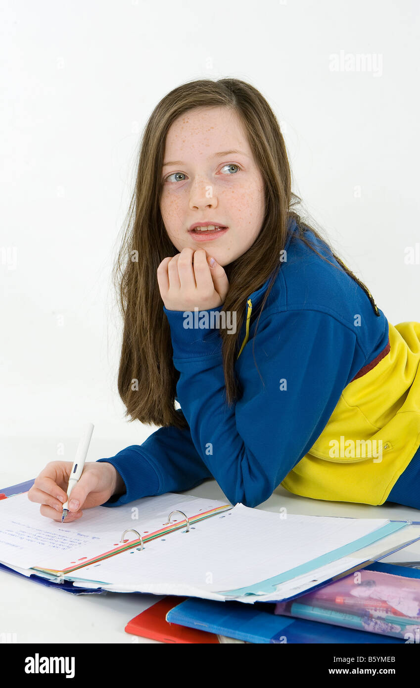 Schoolgirl doing her homework Stock Photo - Alamy