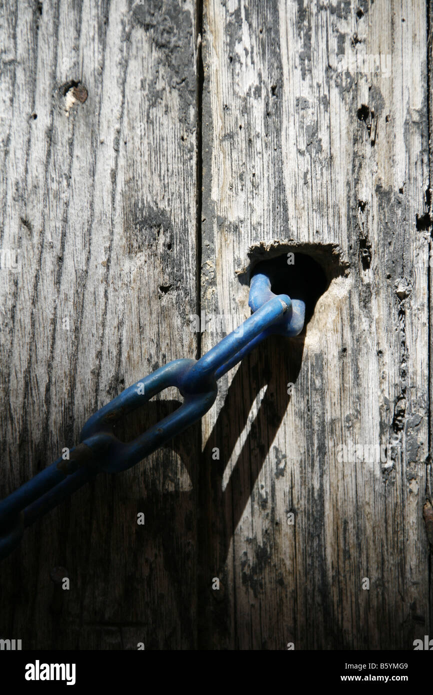 chain with hole in door Stock Photo - Alamy