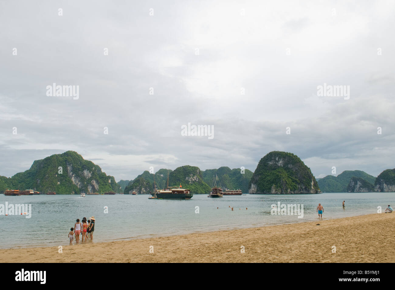 Asian family enjoying the beach, Halong Bay, Vietnam Stock Photo - Alamy