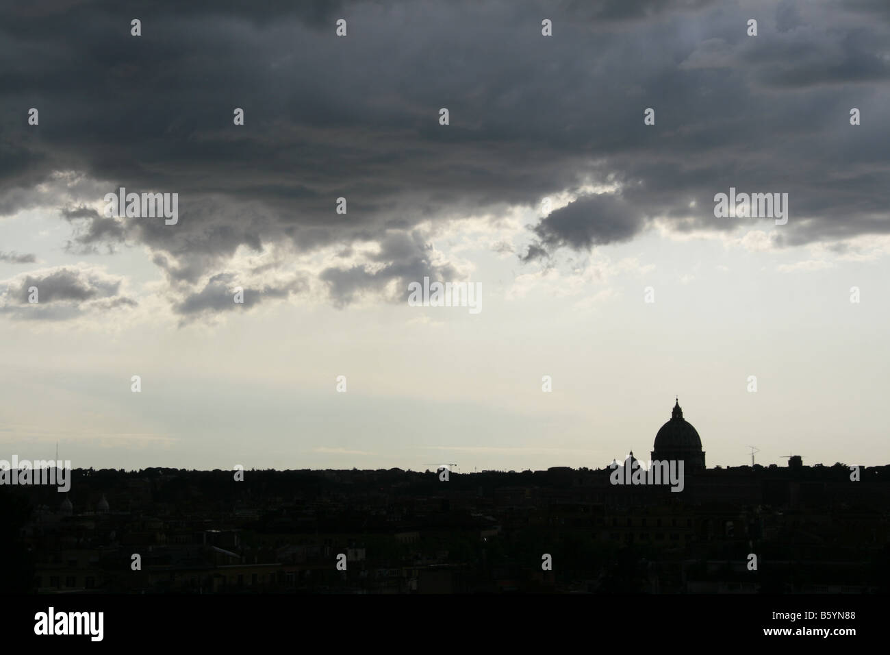 st peter's dome in rome with dark black storm clouds Stock Photo - Alamy