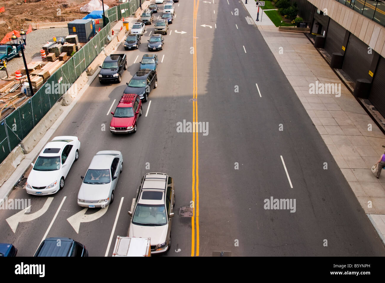 City street with one busy lane and one not busy lane Stock Photo - Alamy