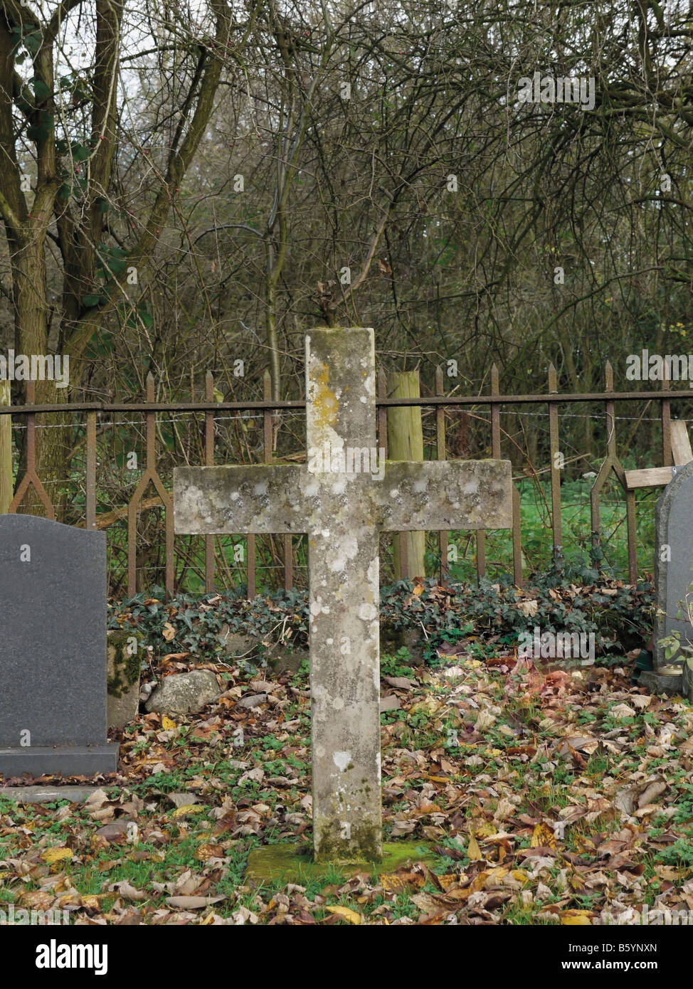 a stone cross in a cemetery Stock Photo - Alamy