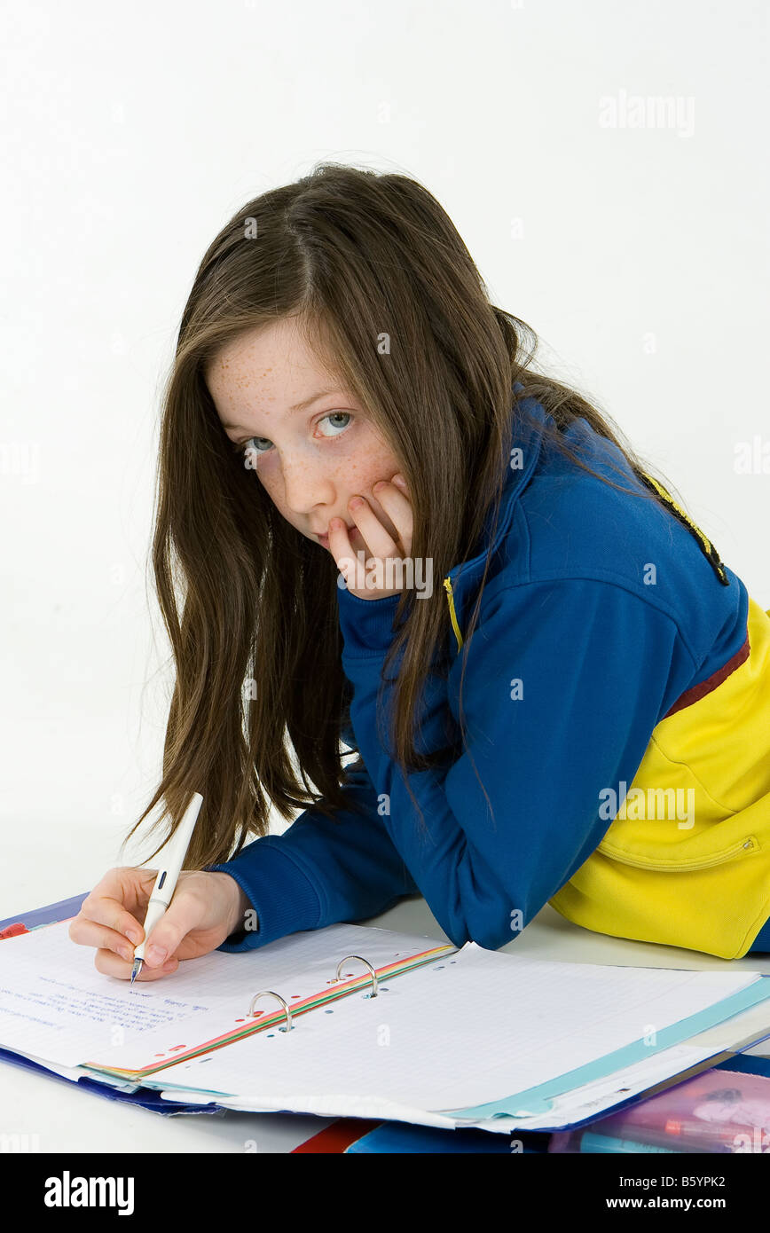 Schoolgirl doing her homework Stock Photo - Alamy