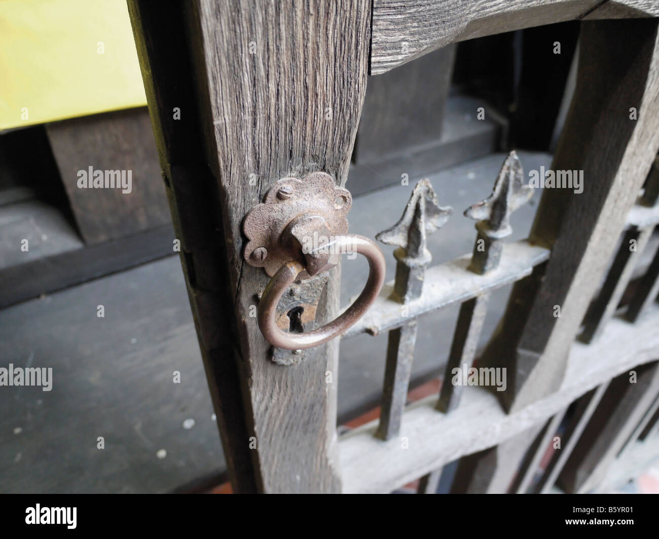 old gate with handles and lock Stock Photo - Alamy