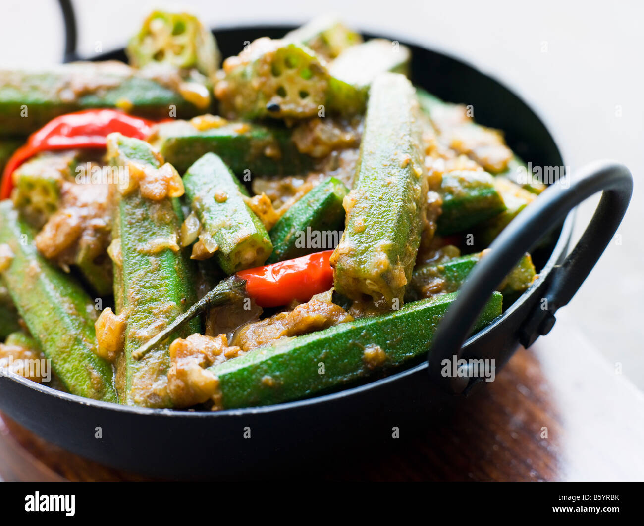 Karahi Dish with Bhindi Masala Stock Photo - Alamy