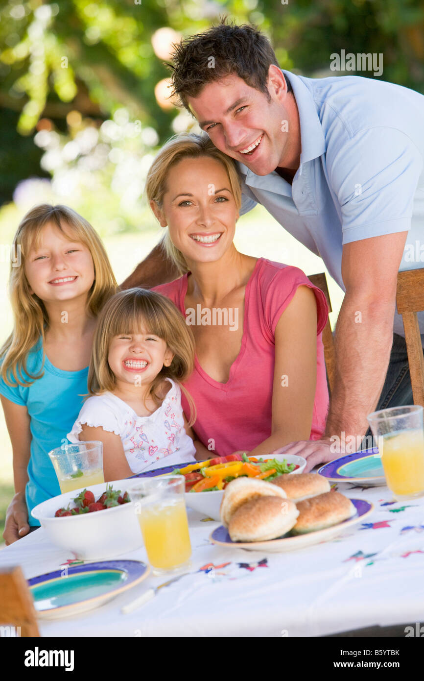 Family Enjoying A Barbeque Stock Photo - Alamy