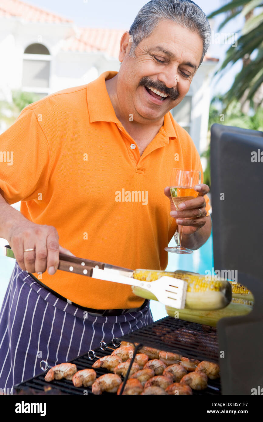Man Barbequing In A Garden Stock Photo - Alamy