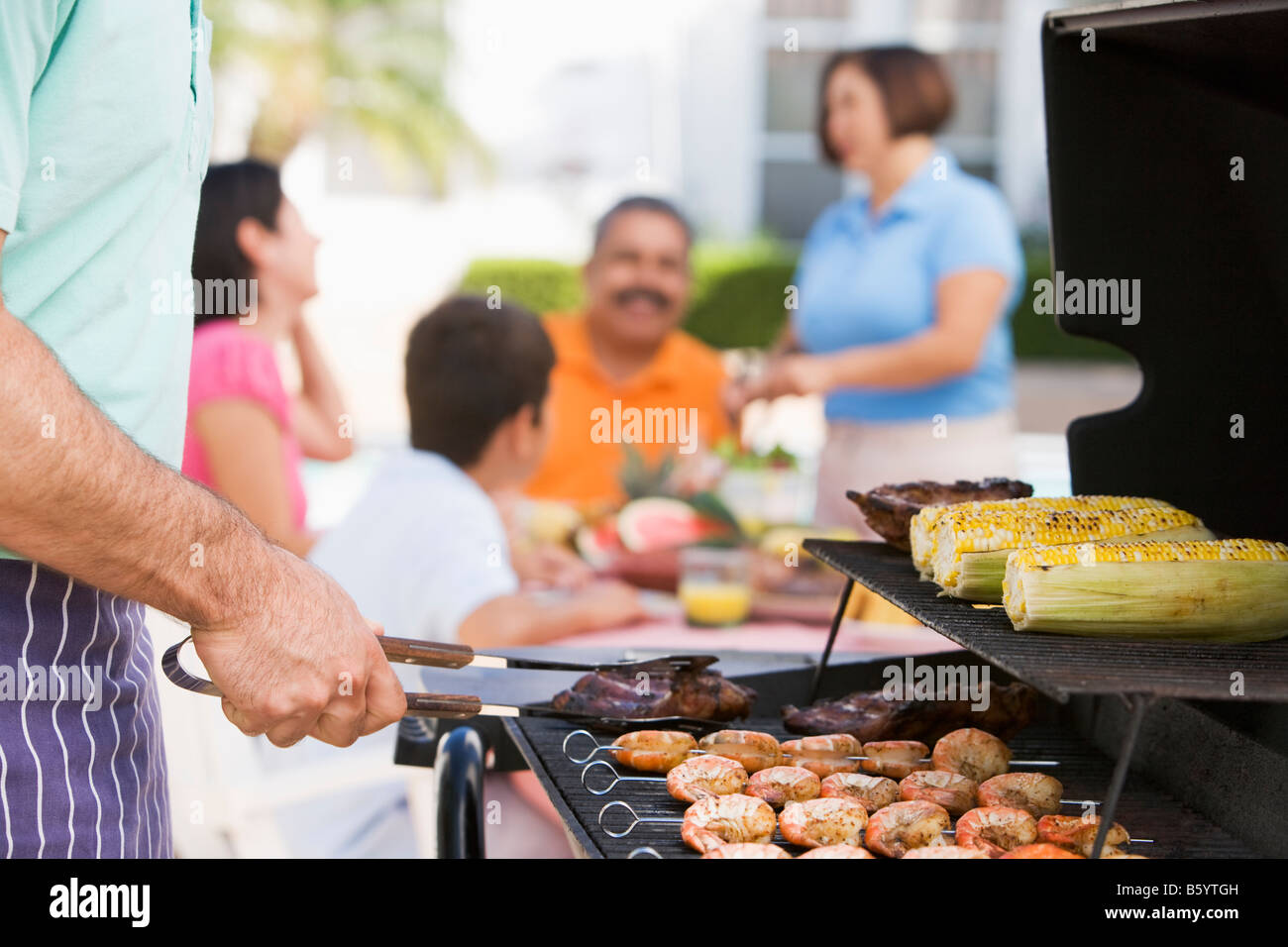 Family barbeque in house hi-res stock photography and images - Alamy