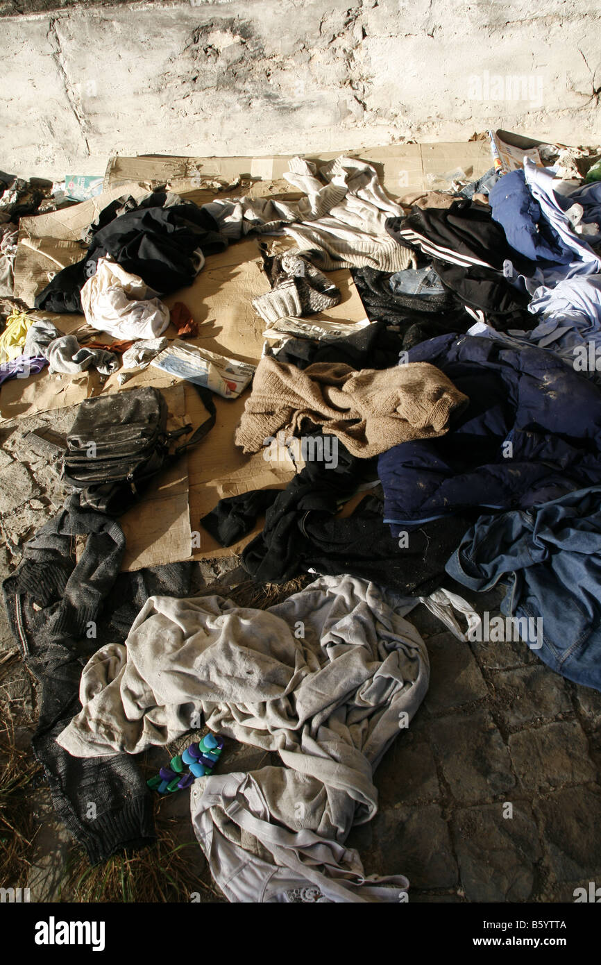 pile of old clothes garments left on street road Stock Photo - Alamy