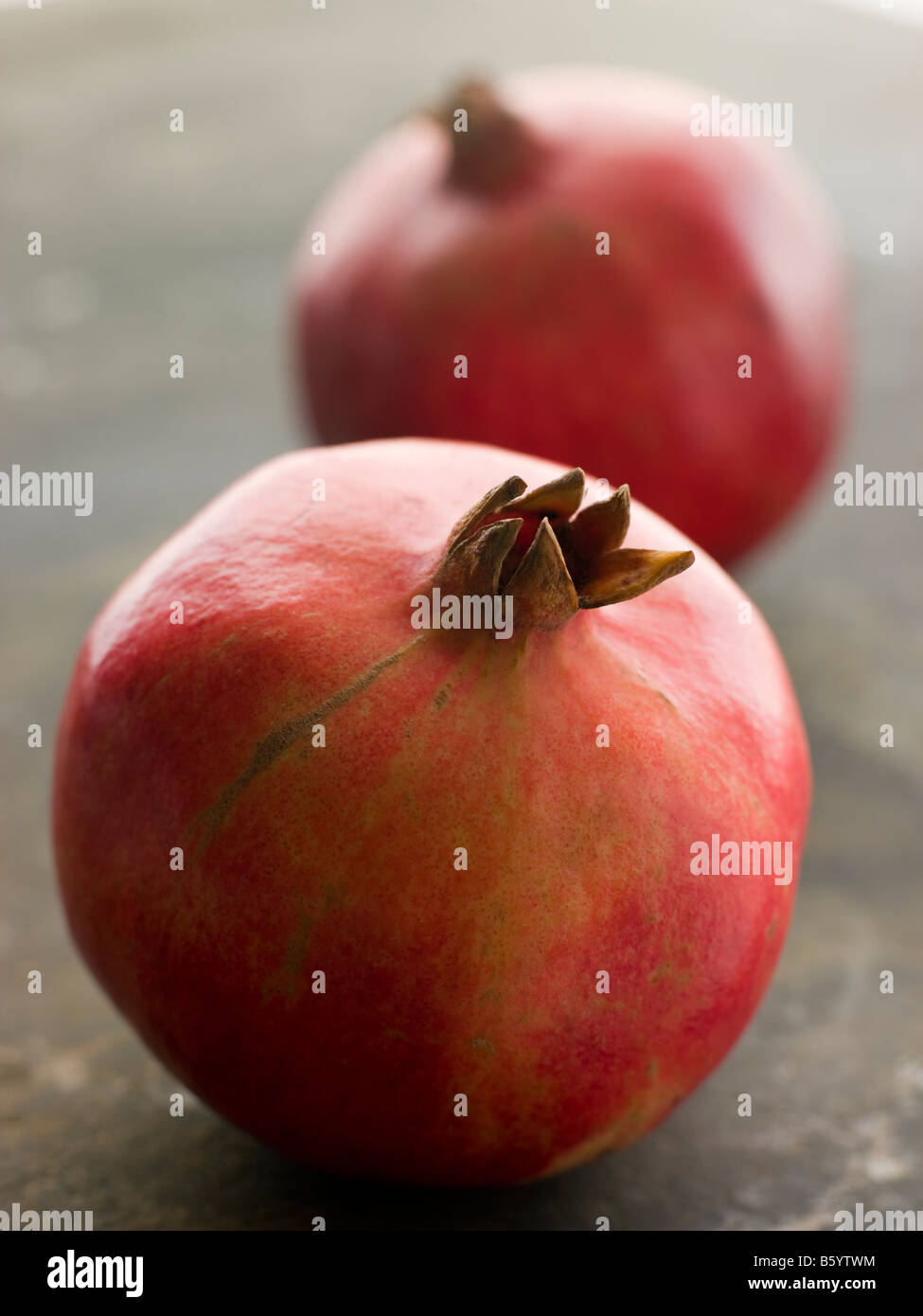 Two whole pomegranates hi-res stock photography and images - Alamy