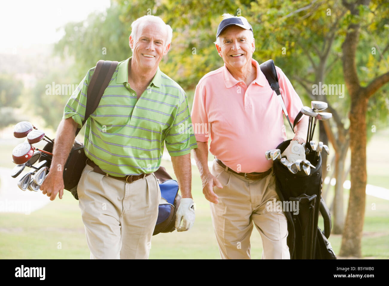 Male Friends Enjoying A Game Of Golf Stock Photo - Alamy