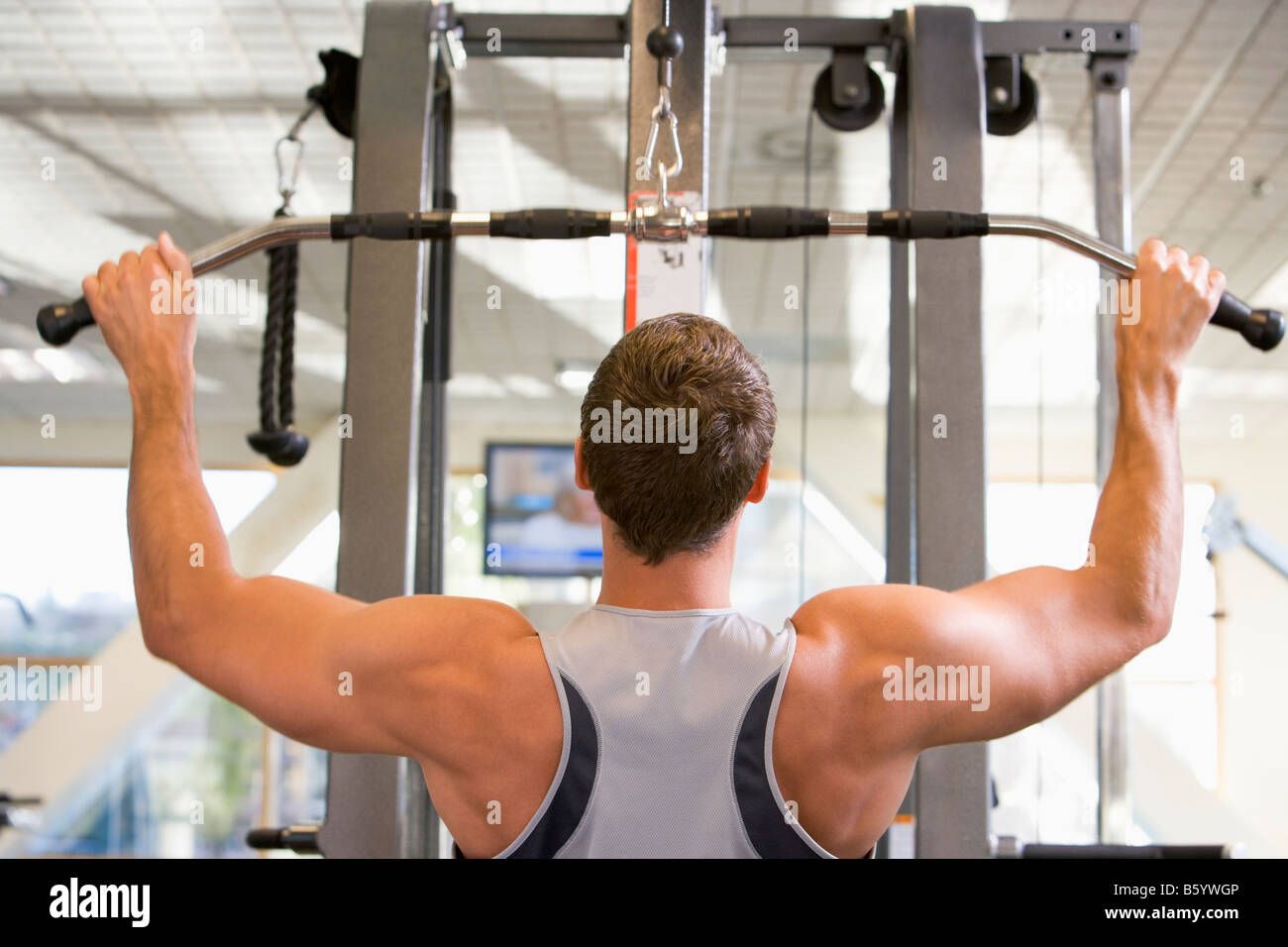 Man Weight Training At Gym Stock Photo - Alamy