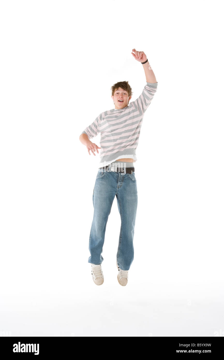 Teenage Boy Jumping In The Air Stock Photo - Alamy