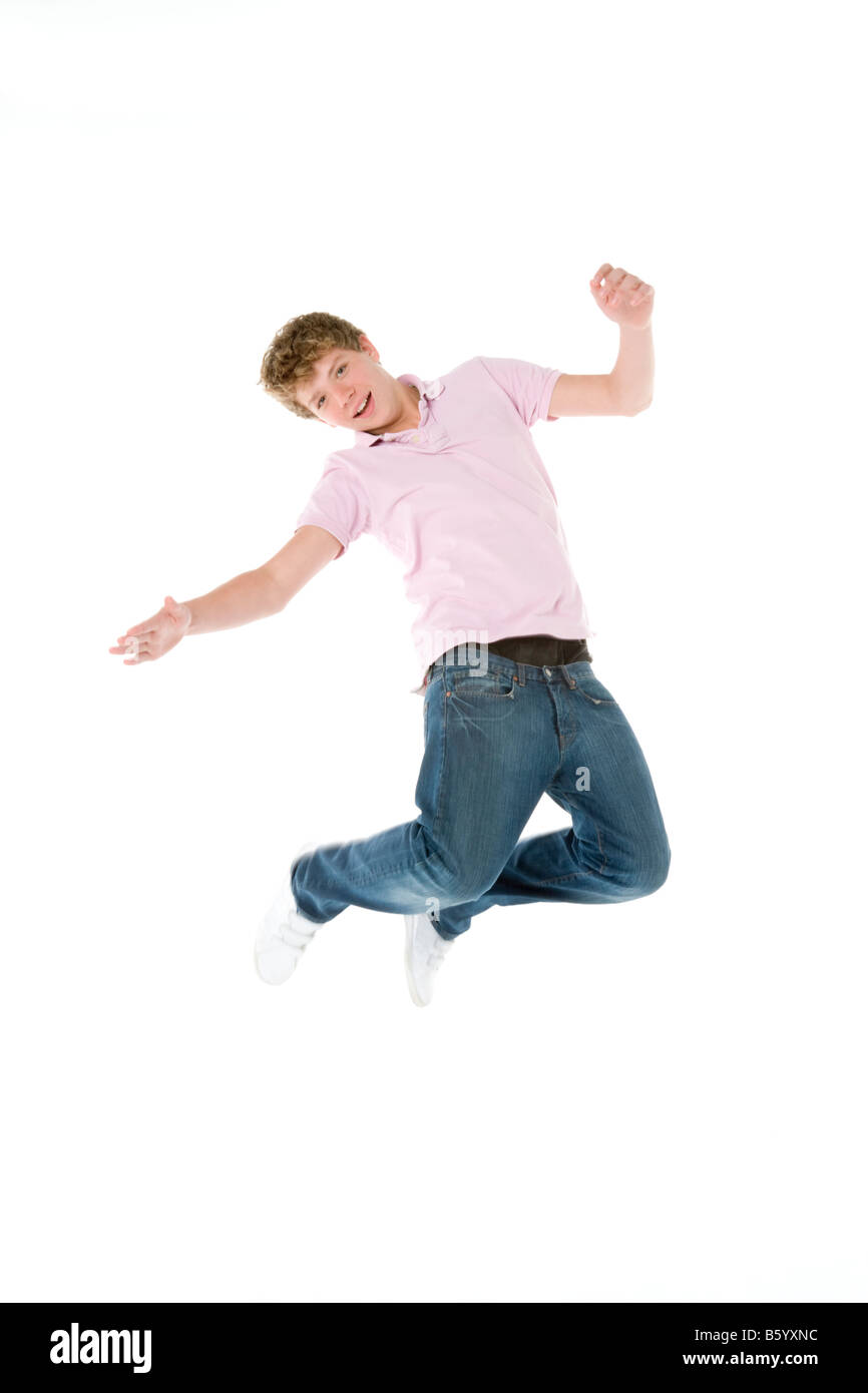 Teenage Boy Jumping In The Air Stock Photo - Alamy
