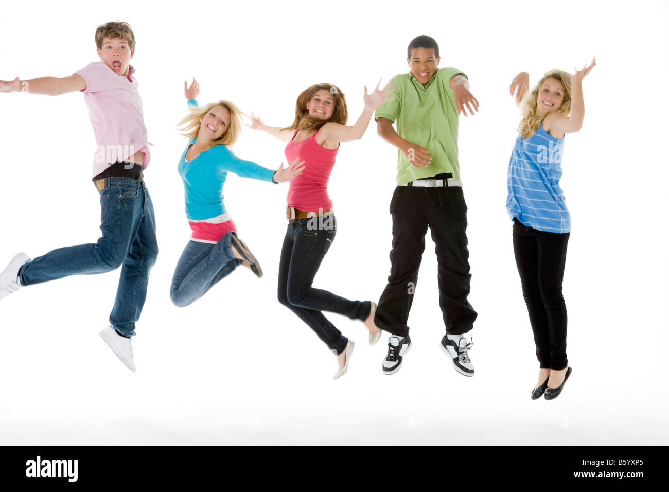 Teenagers Jumping In The Air Stock Photo - Alamy