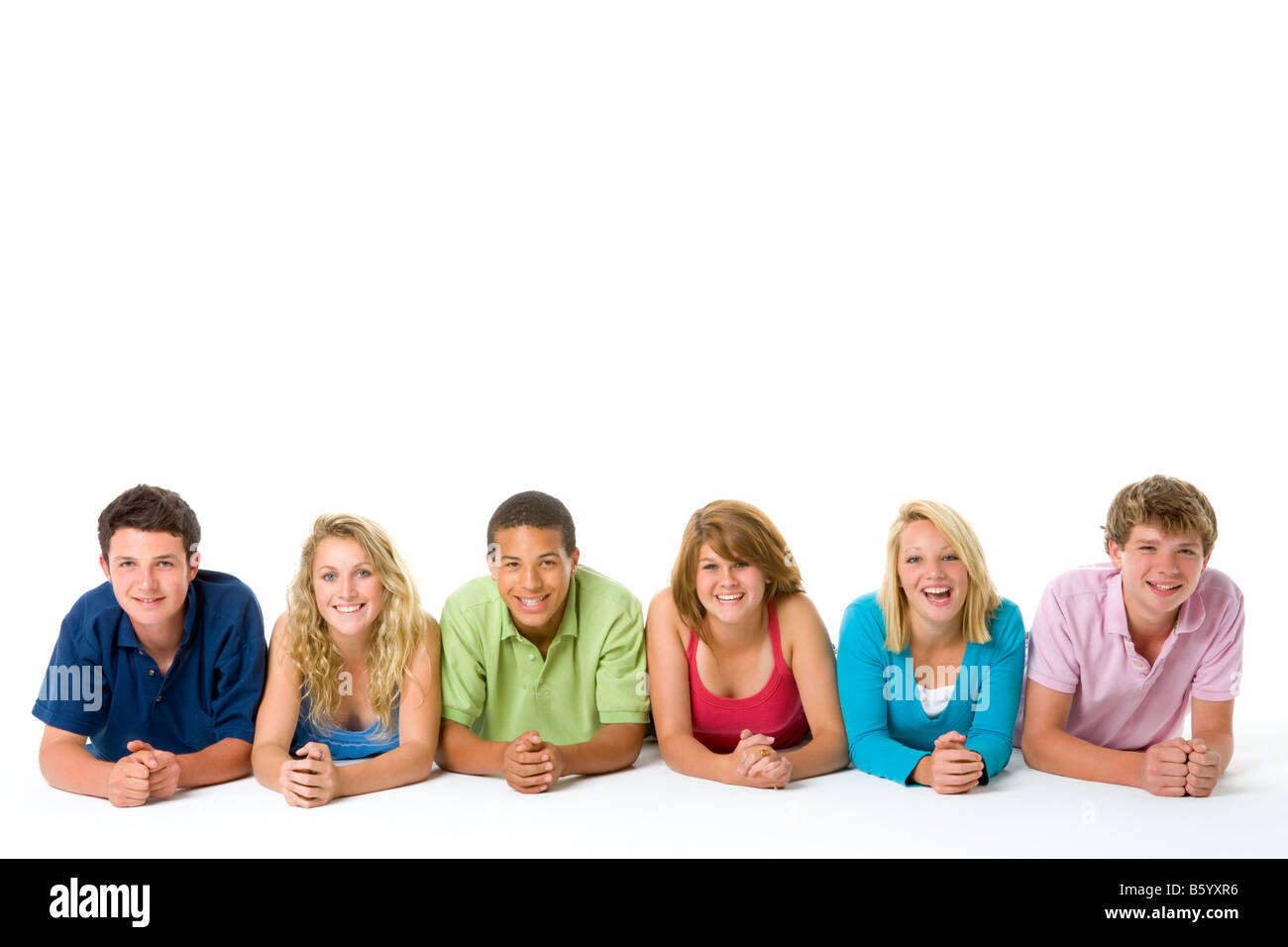 Teenagers Lying Down In A Row Stock Photo - Alamy