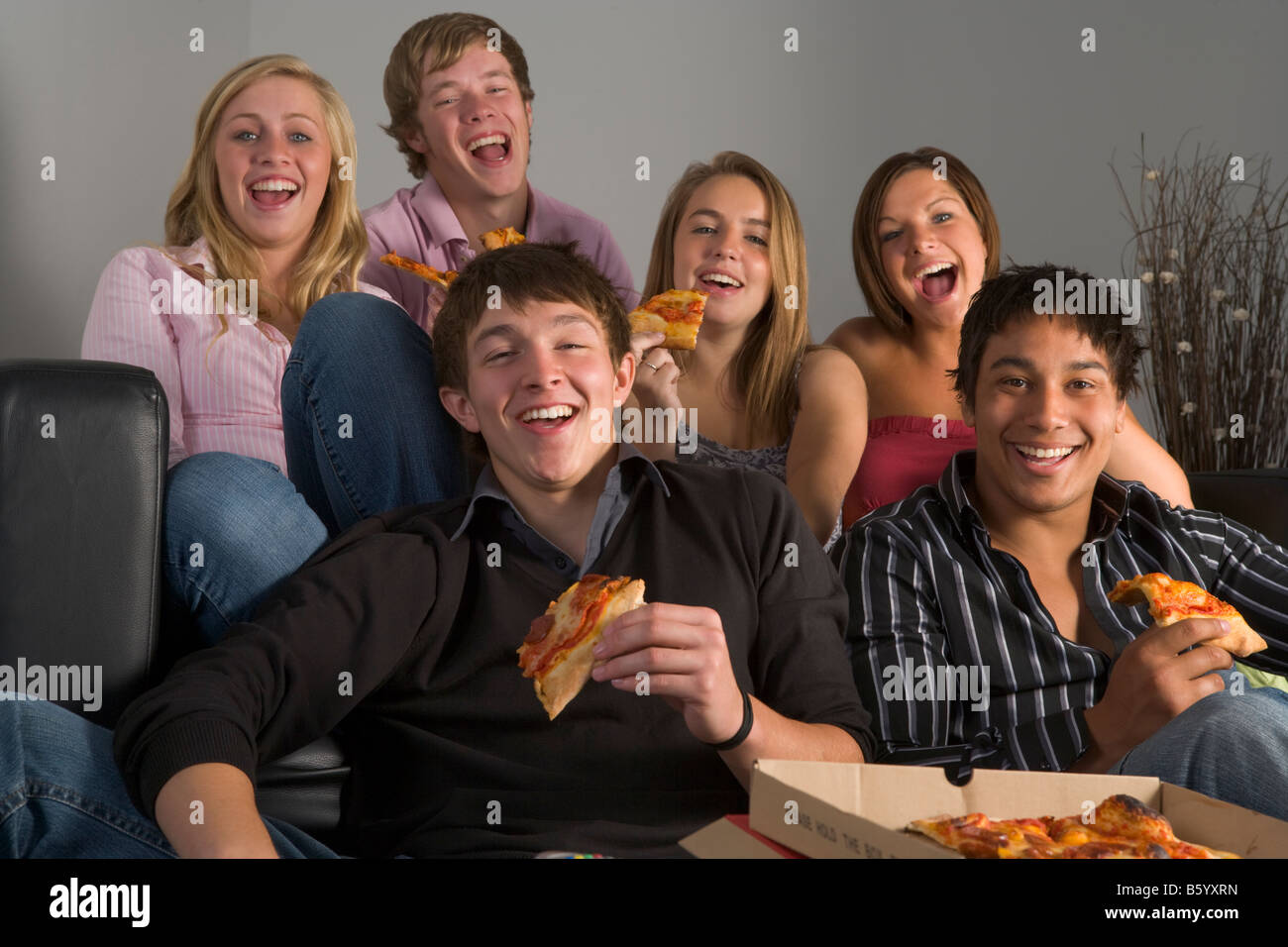 Teenagers Having Fun And Eating Pizza Stock Photo - Alamy
