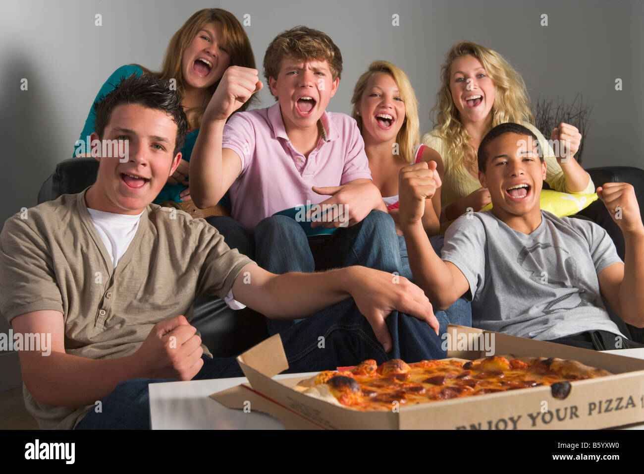 Teenagers Having Fun And Eating Pizza Stock Photo - Alamy