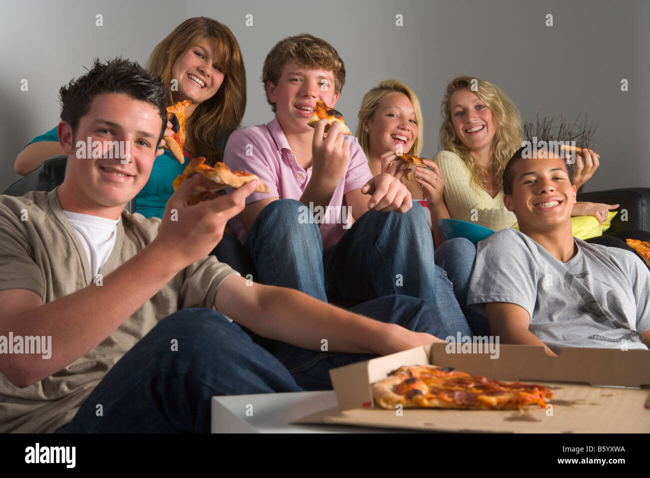 Teenagers Having Fun And Eating Pizza Stock Photo - Alamy