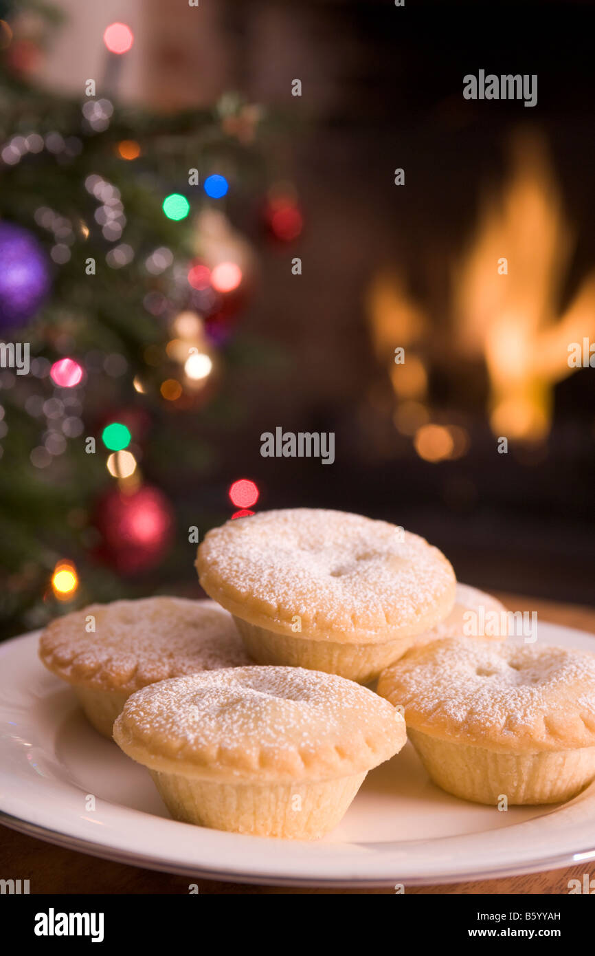 Plate of Mince Pies Log Fire and Christmas Tree Stock Photo - Alamy