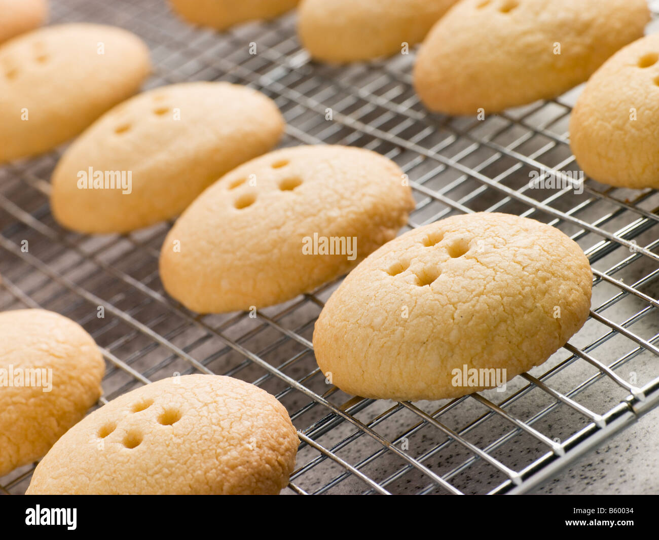 Wellington Button Biscuits on a Cooling Rack Stock Photo - Alamy