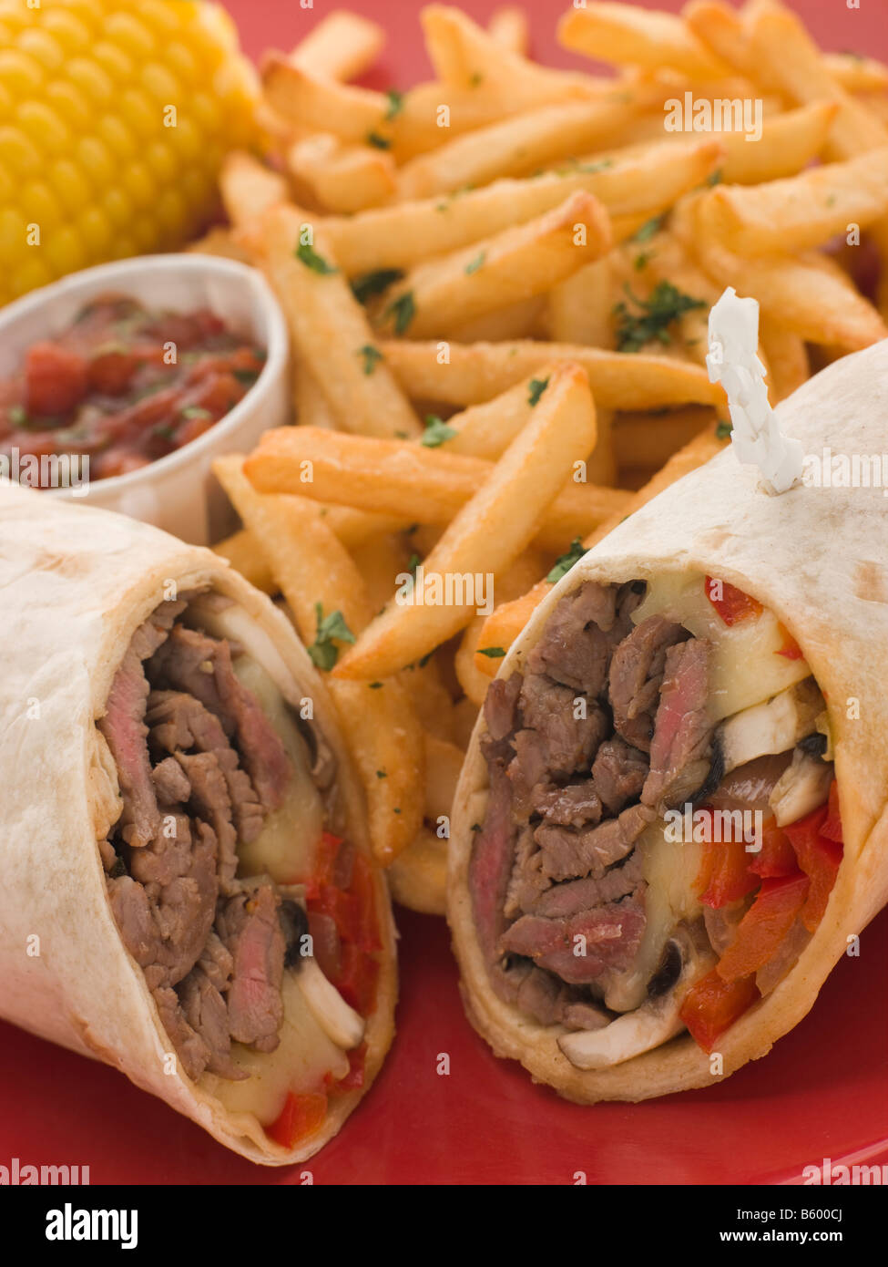 Philly Beef Steak Wrap with Fries Tomato Salsa and Corn Stock Photo - Alamy
