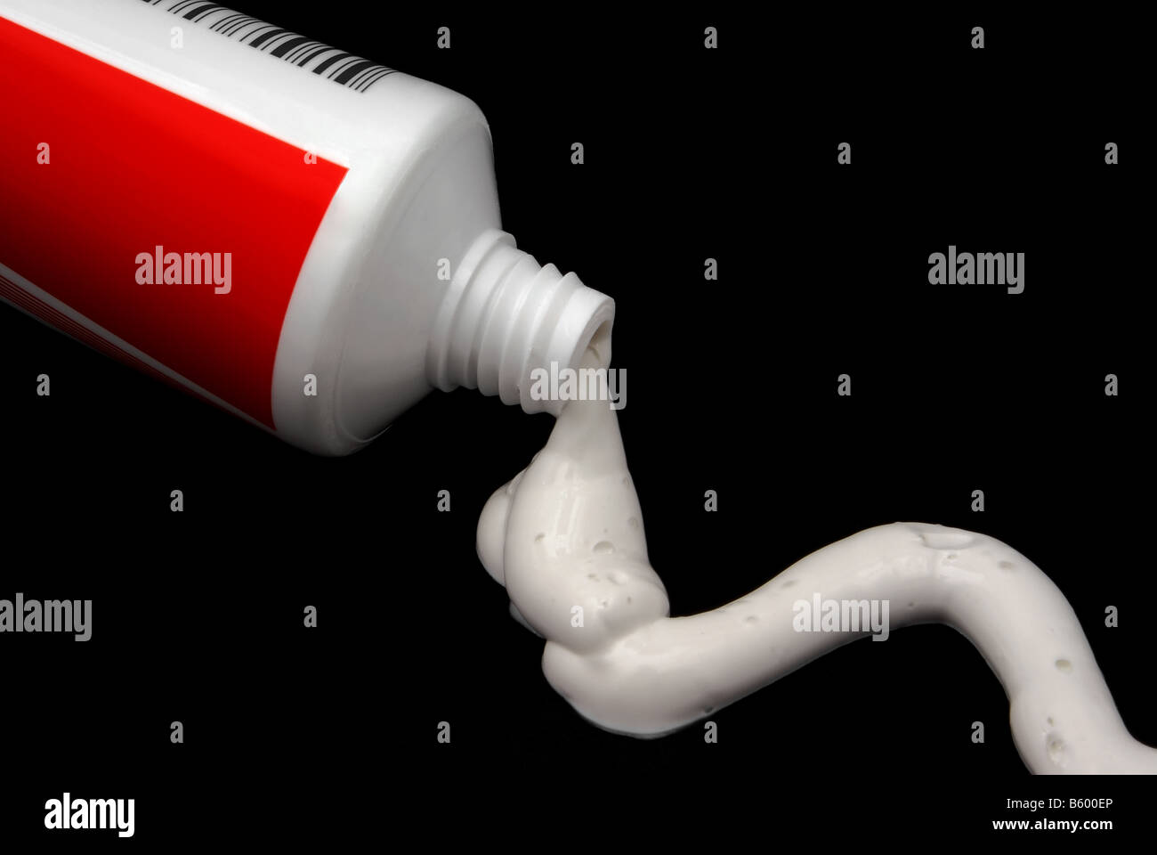 Toothpaste from the opening of a tube The object on a black background ...