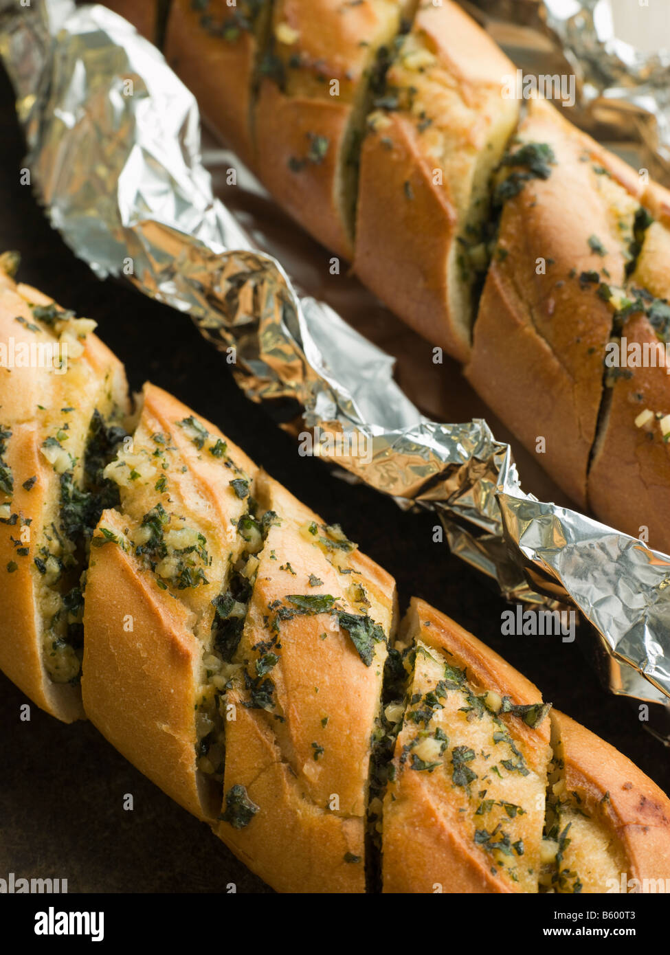 Two Garlic Buttered French Sticks Stock Photo - Alamy