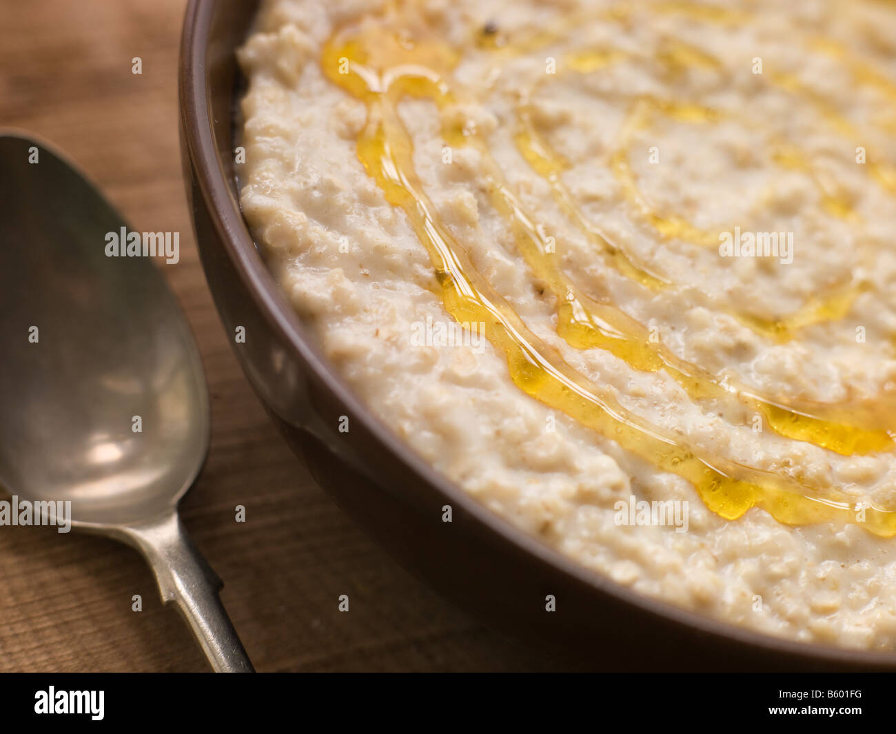 Bowl of Porridge with Golden Syrup Stock Photo - Alamy