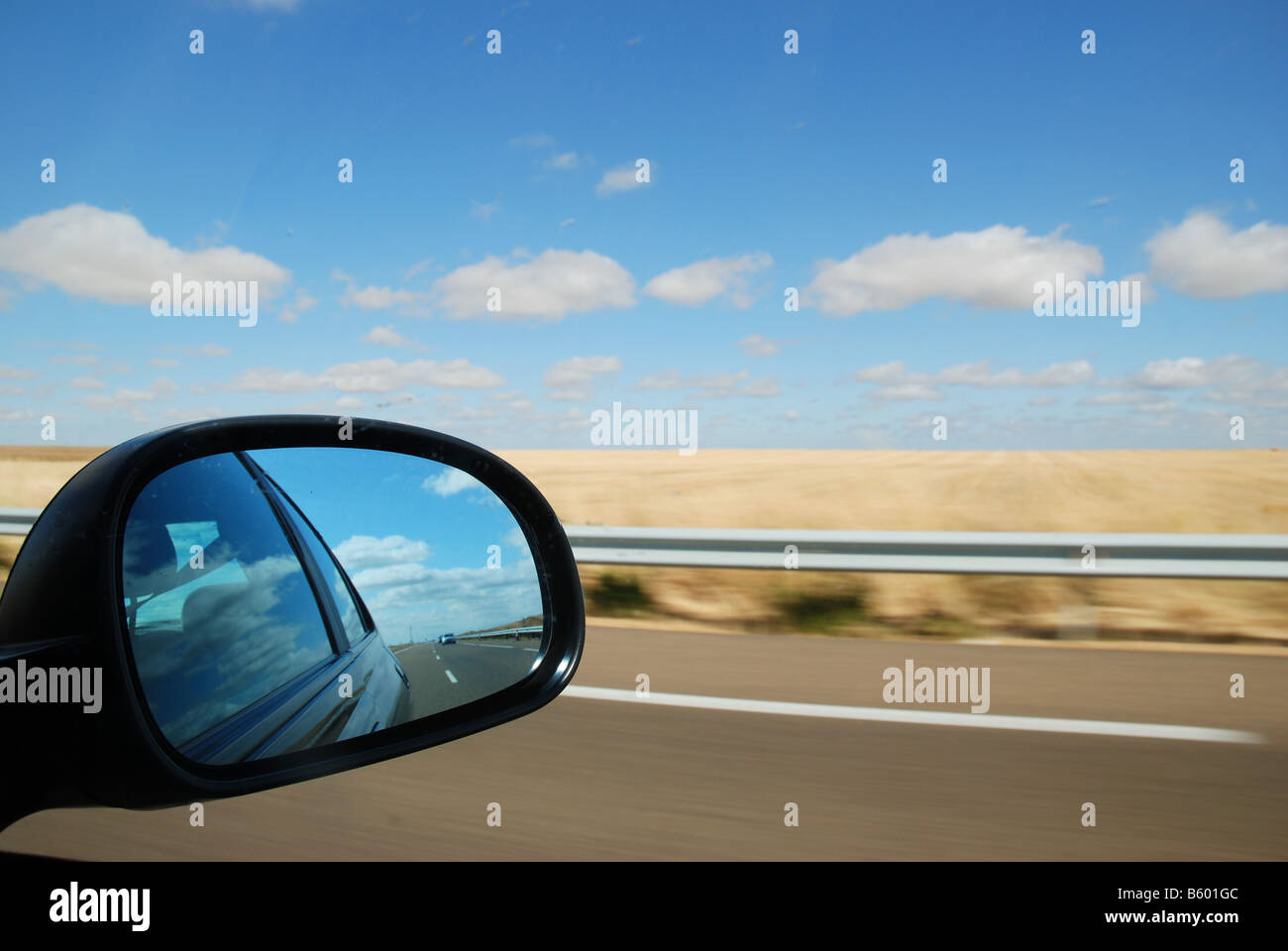 Car and road reflected on rear view mirror Stock Photo - Alamy