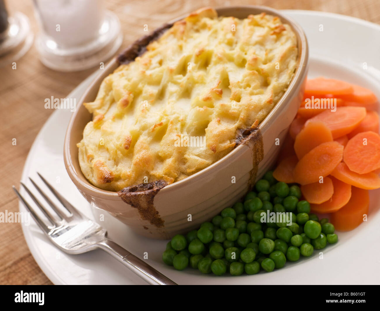 Individual Cottage Pie with Peas and Carrots Stock Photo - Alamy