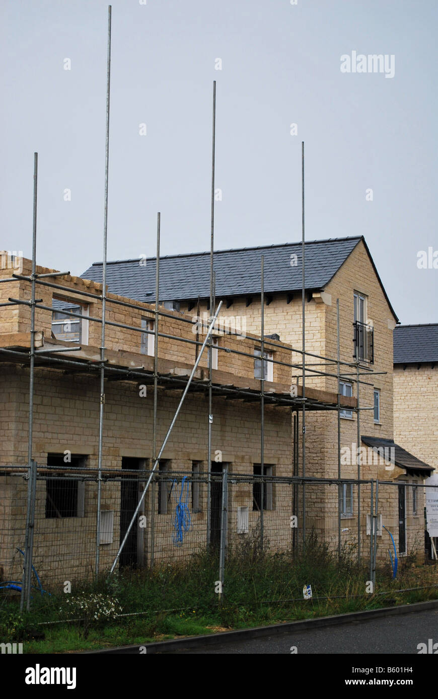 Scaffolding on partially built houses Stock Photo - Alamy