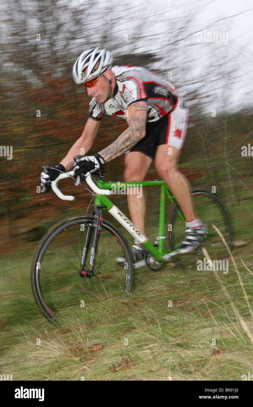A man racing on a cyclo-cross bike Stock Photo - Alamy