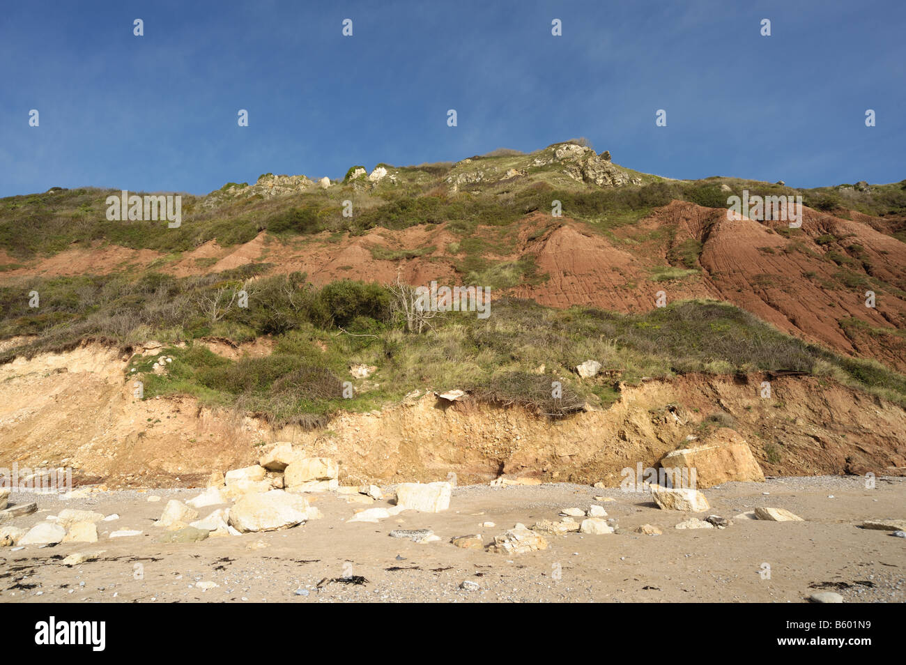Red sand & limestone outcrop on the coastal cliffs of Branscombe, East ...