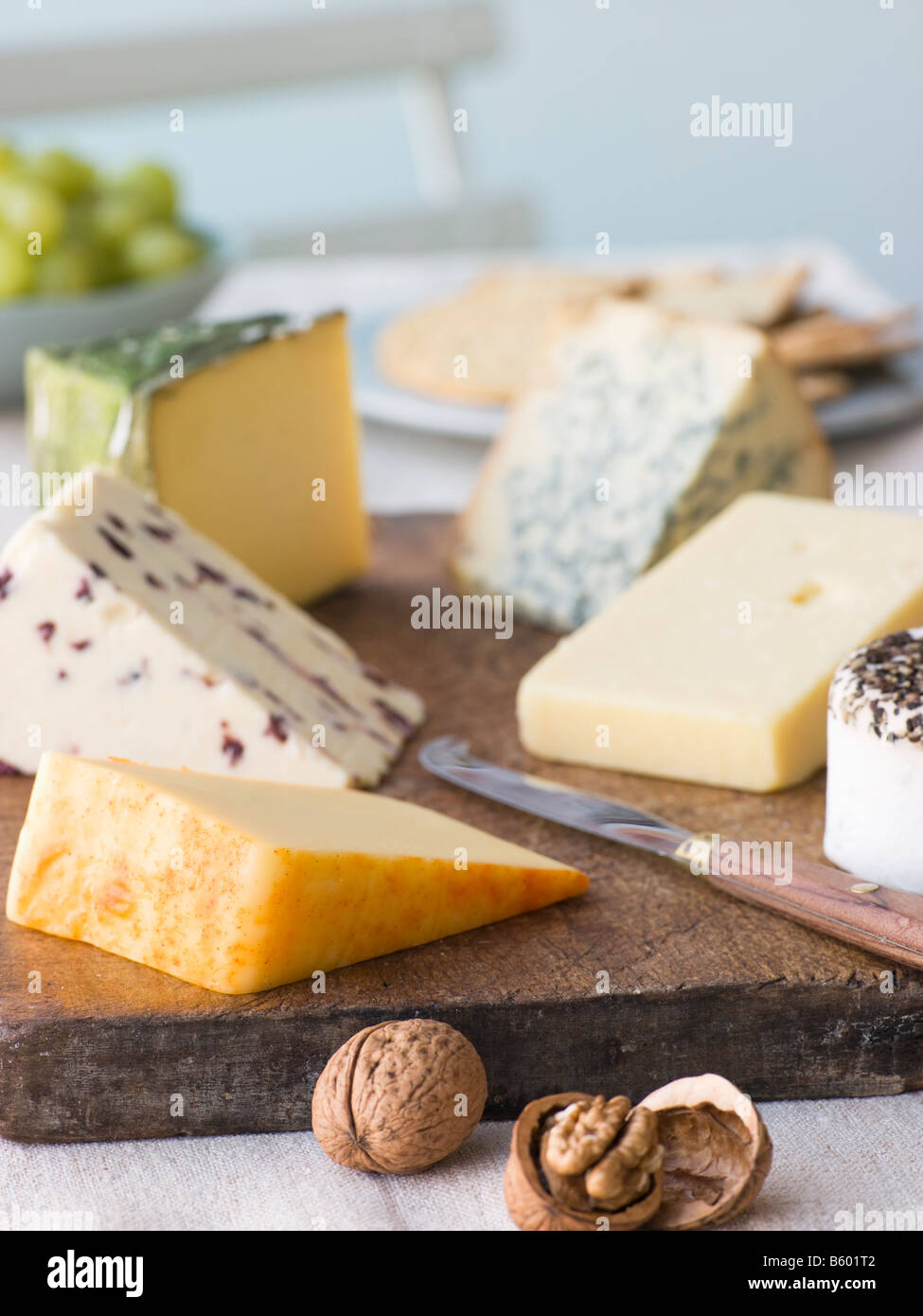 Selection of British Cheeses with Walnuts Biscuits and Grapes Stock ...