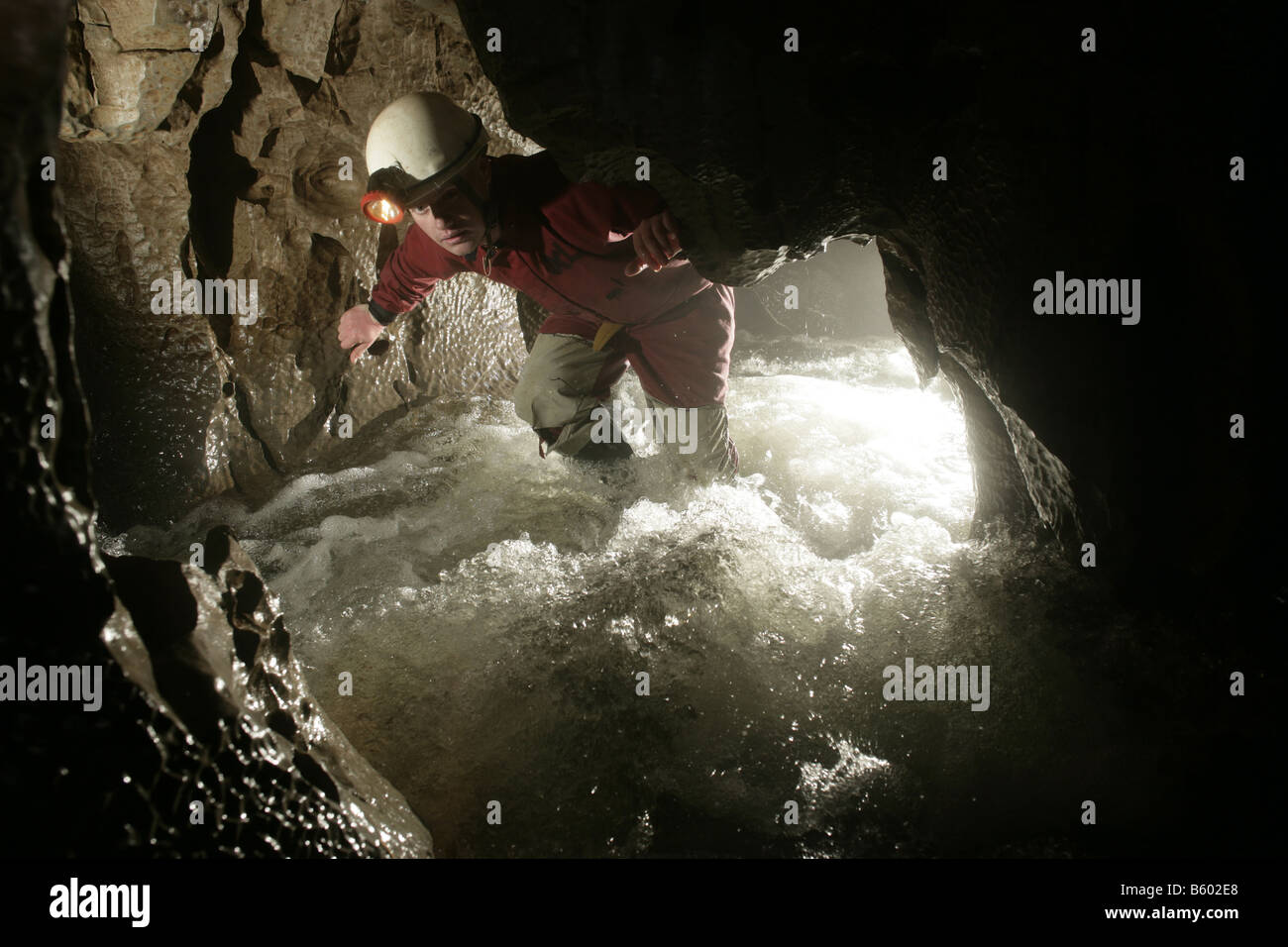 A caver explores a passage in Bridge Cave in the Neath Valley of South ...