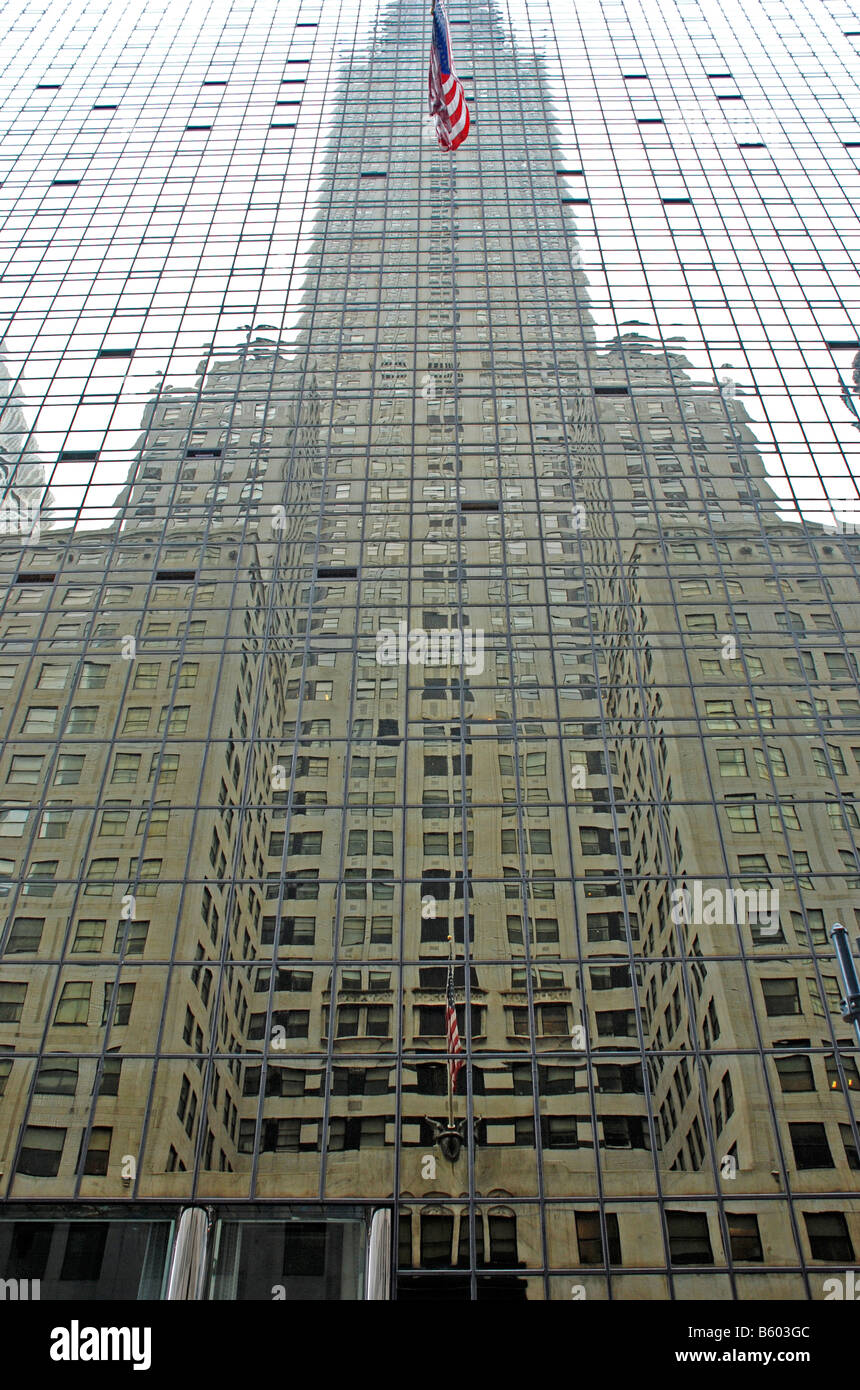 Chrysler building reflected in glass building opposite Stock Photo - Alamy