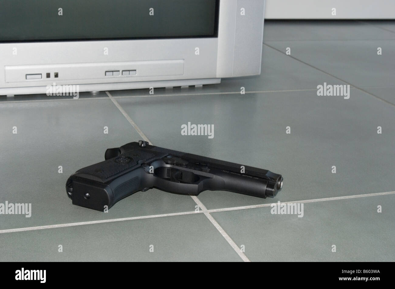 gun and television on the floor Stock Photo - Alamy
